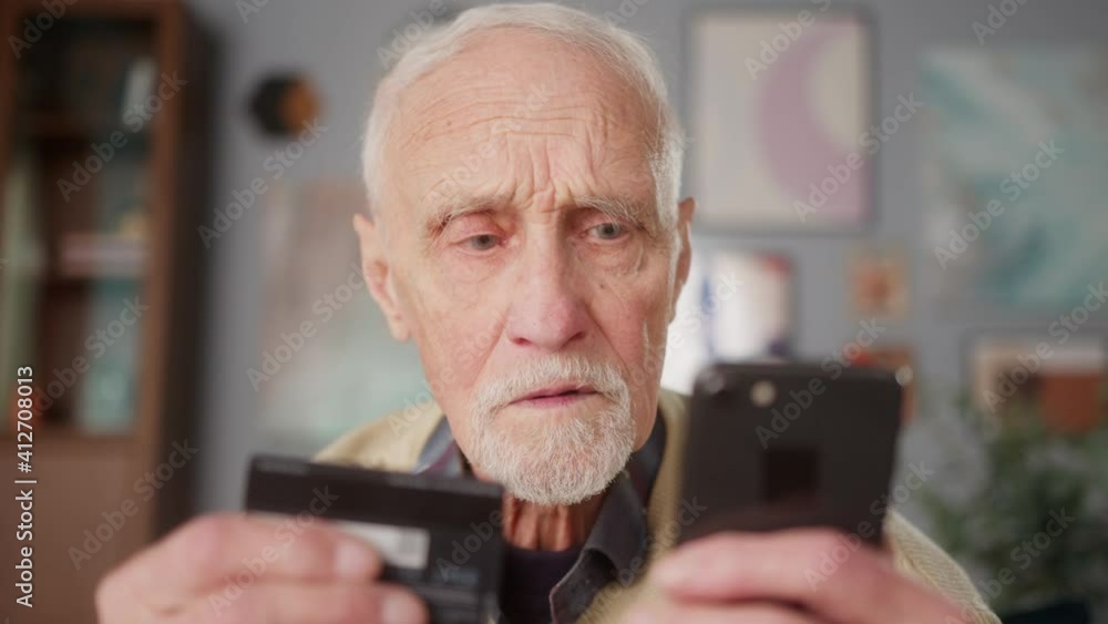 Portrait of senior old man using phone for online shopping purchase ...