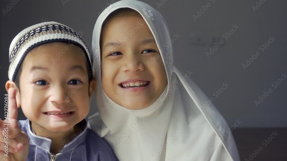 Closed up shot of Asian Muslim kids.young sister and brother sibling in ...