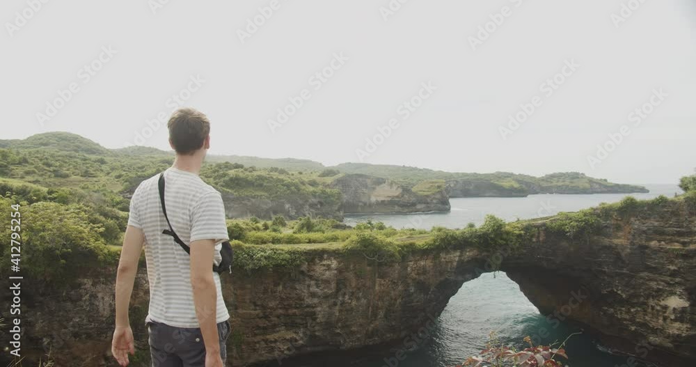 Close up medium shot of a male tourist in Bali looking at stunning ...