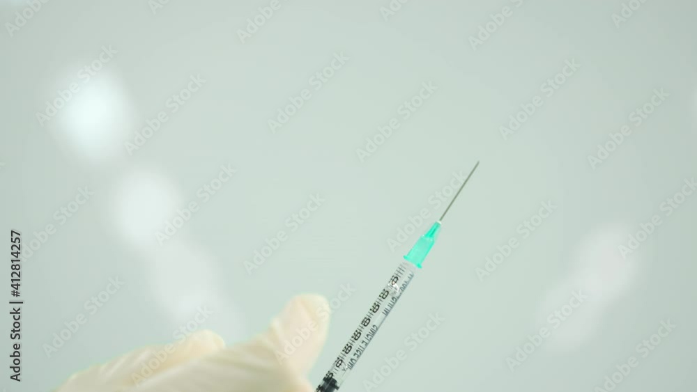 Remove air bubble from syringe before injection vaccine to patient ...