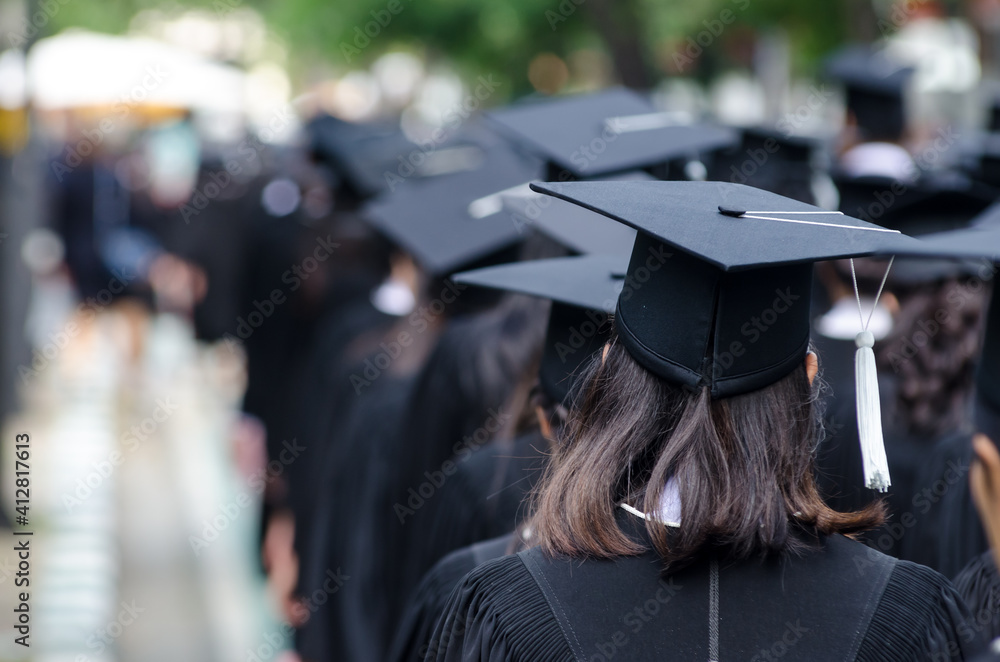 Fotografia do Stock: The shot of graduation hats and the back of ...