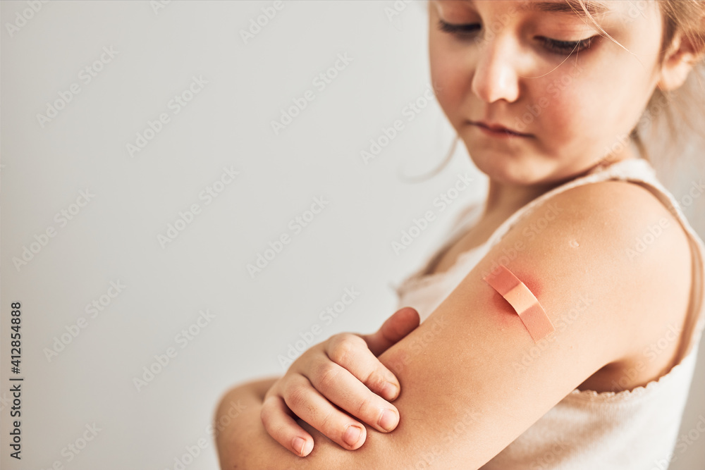 Little girl feeling pain having some side effects after vaccination ...