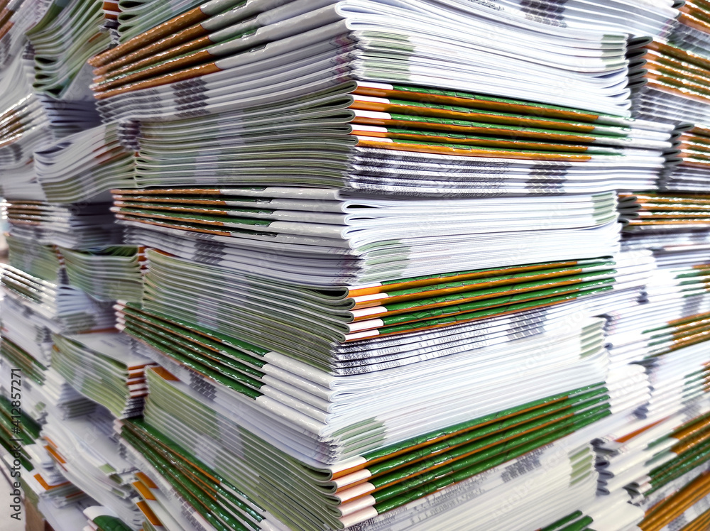 Lot of books stacked in layers in huge endless wall of knowledge ...