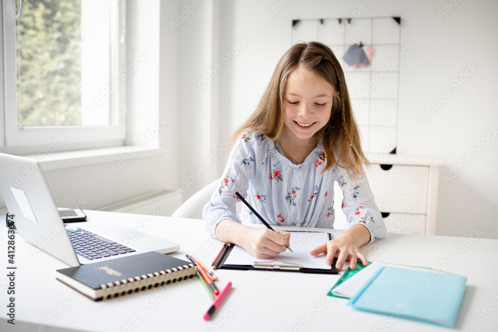 girl school pupil distance learning doining school homework, watching ...