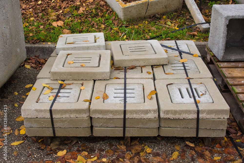 A pallet of lids for reinforced concrete square box culverts on a ...