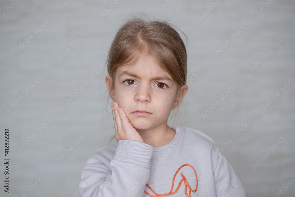 Little girl with sad expression and tears. Portrait of bored and crying ...