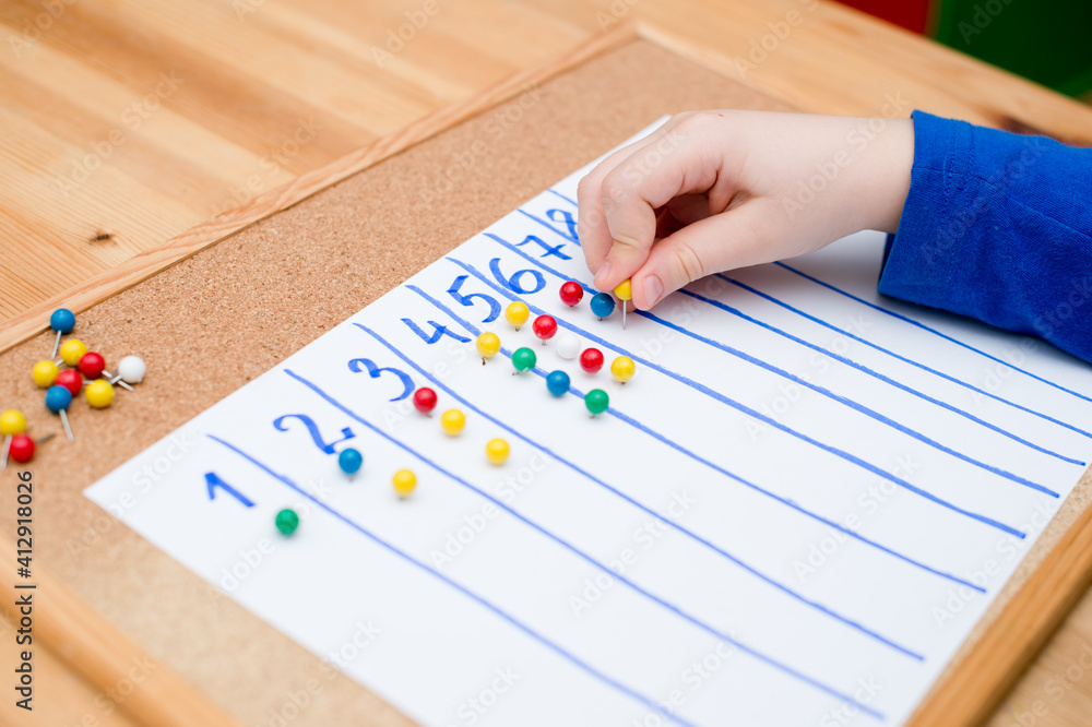 Little child doing simple math exercises. Early education, counting ... Little child doing simple math exercises. Early education, counting ...