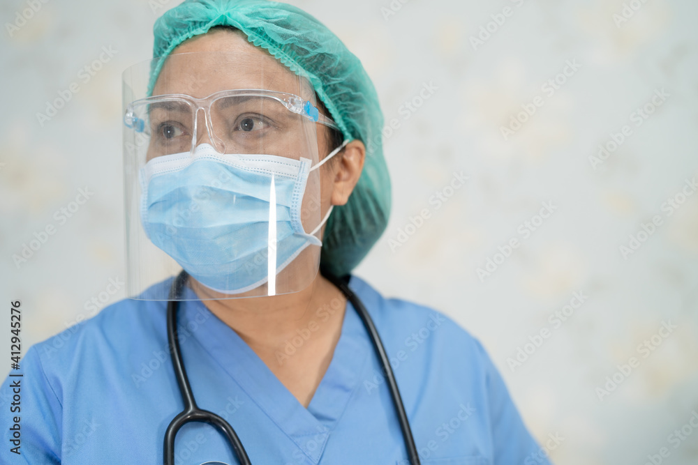Asian doctor wearing face shield and PPE suit new normal to check ...