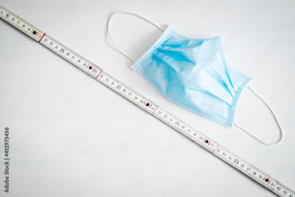 Concept of social distance in the workplace, one meter of wood and a ...