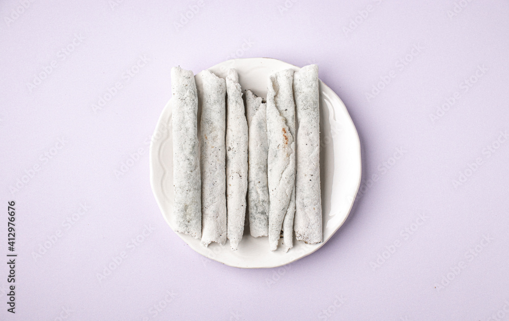 Til pitha a traditional food of Assam isolated stock image. Stock Photo ...