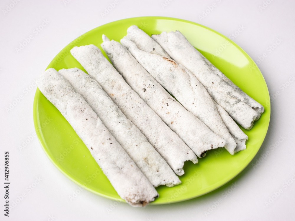 Til pitha a traditional food of Assam isolated stock image. Stock Photo ...