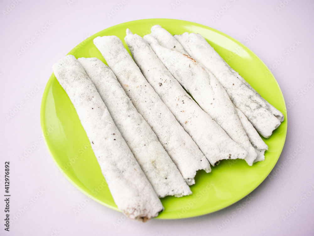 Til pitha a traditional food of Assam isolated stock image. Stock Photo ...