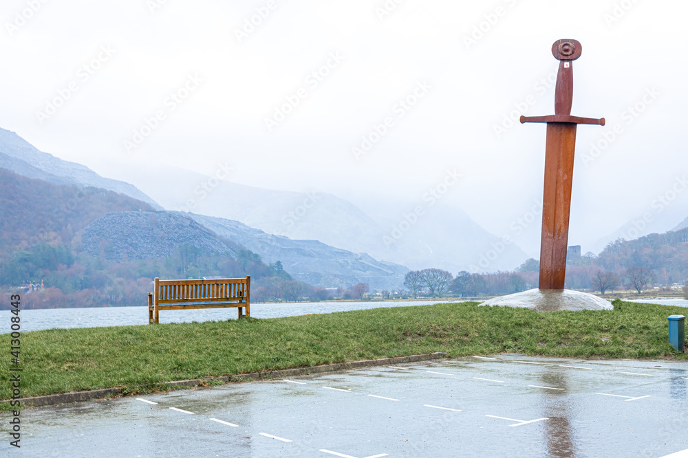 A blade of the Giants, a Welsh symbol at the lake of Llyn Padarn, Wales ...