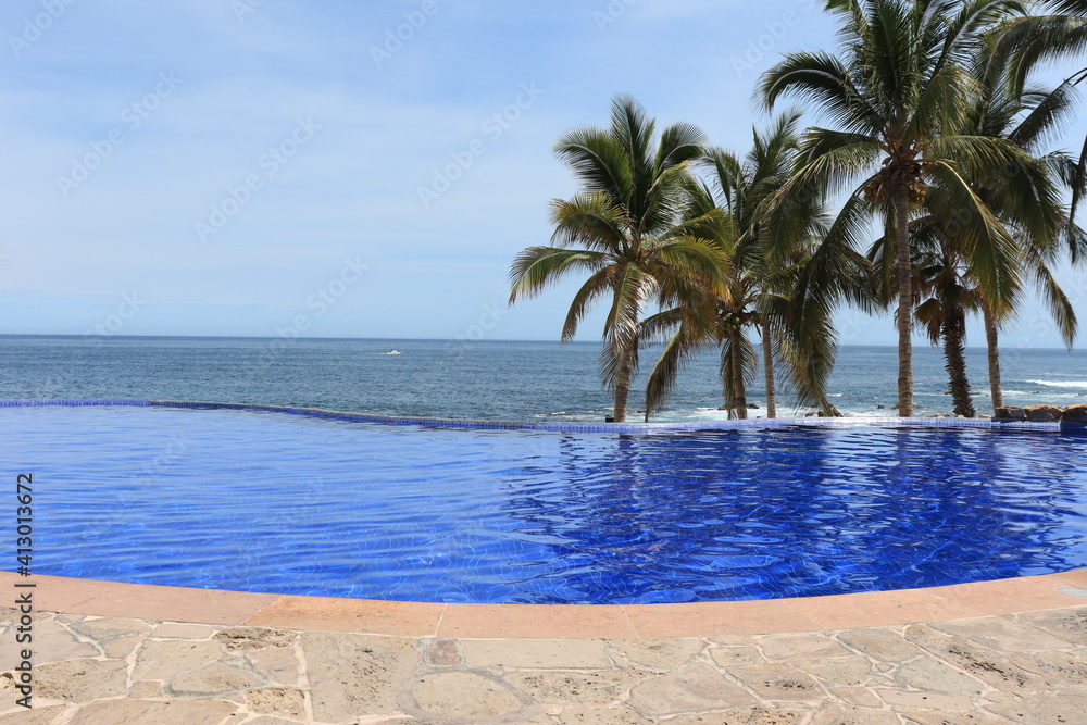 An amazing view of the ocean, palm trees, and the beach from the ...