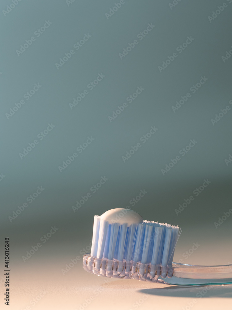 vertical photograph of toothbrush, with the appropriate toothpaste ...