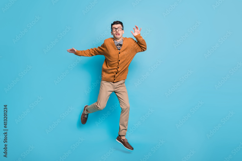 Full body photo of scared young man jump up air afraid wear glasses ...