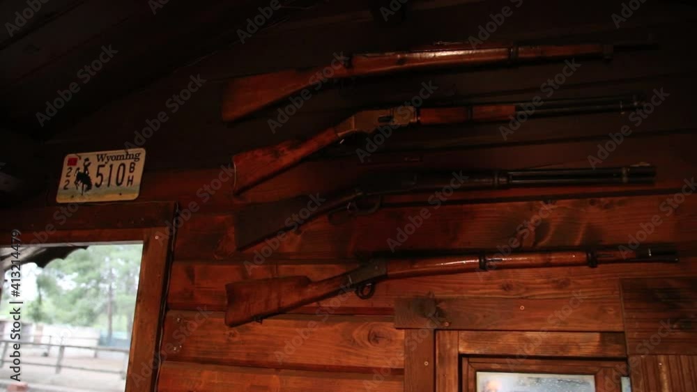 Interior of a cowboy's house with different rifles from the Wild West ...