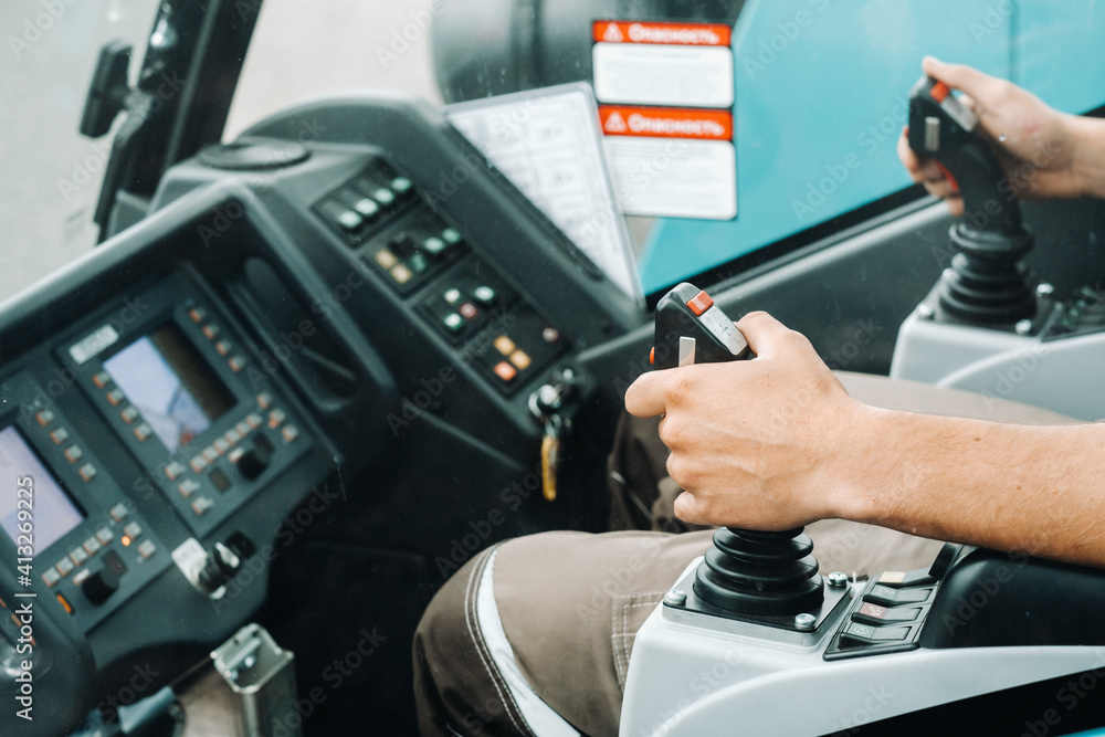 Close up of a hand holding the control stick and ready to work in the ...