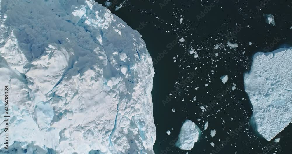Top down icebergs at ocean bay aerial. Environment climate change ...