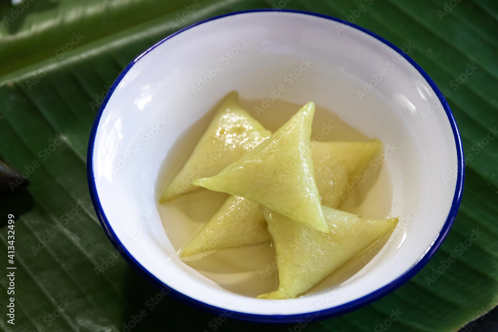 Dessert made with glutinous rice wrapped in banana leaves, triangle ...
