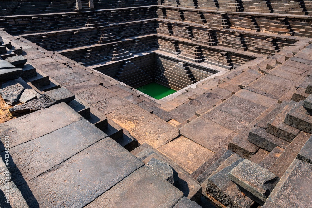 Pushkarini Stepwell with aqueducts. Stepped tank in the royal enclosure ...