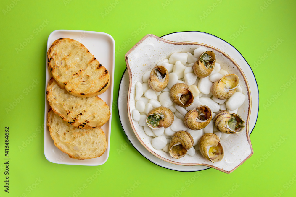 Escargots de Bourgogne. Fried snails with garlic butter, gourmet dish ...
