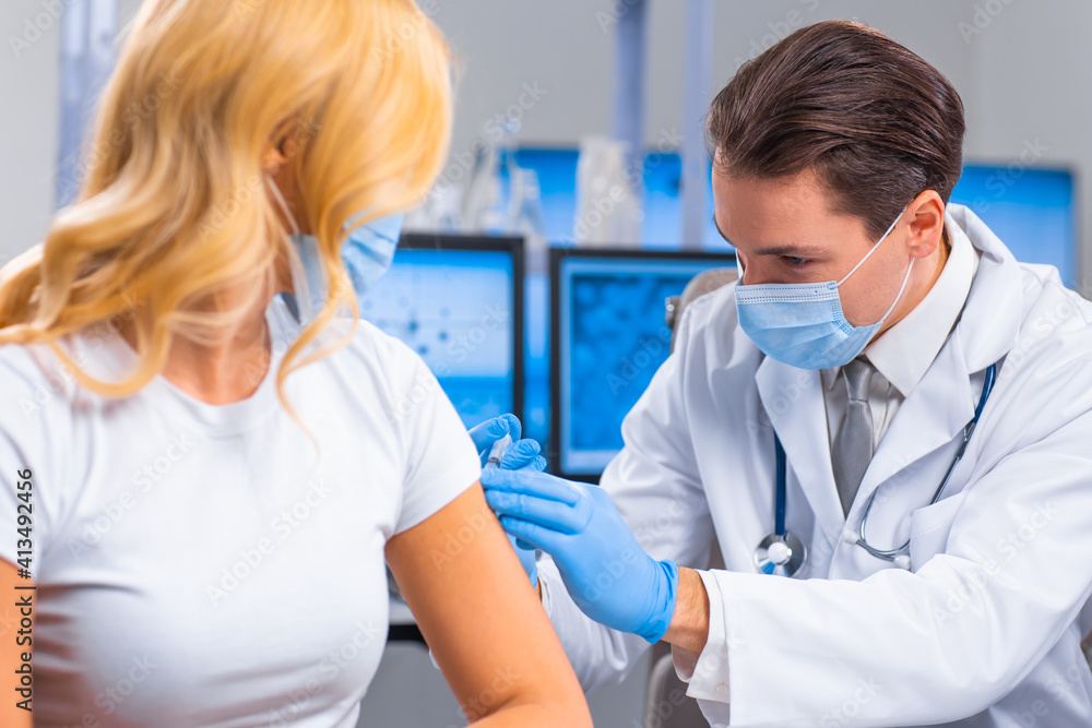 Professional doctor makes a coronavirus vaccine using a syringe and ...