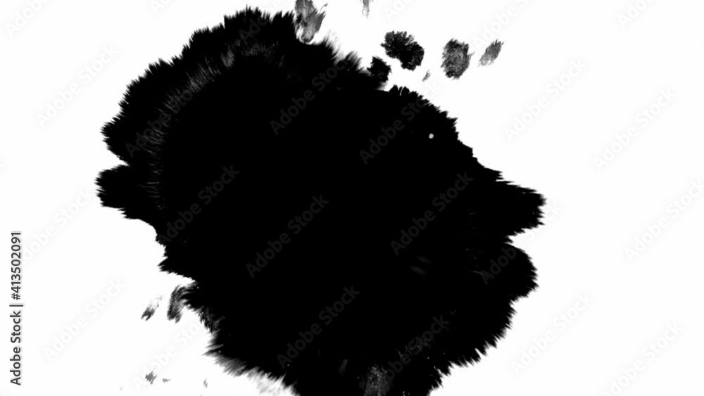 Black ink drops dripping on white paper. Beautiful black watercolor ink ...