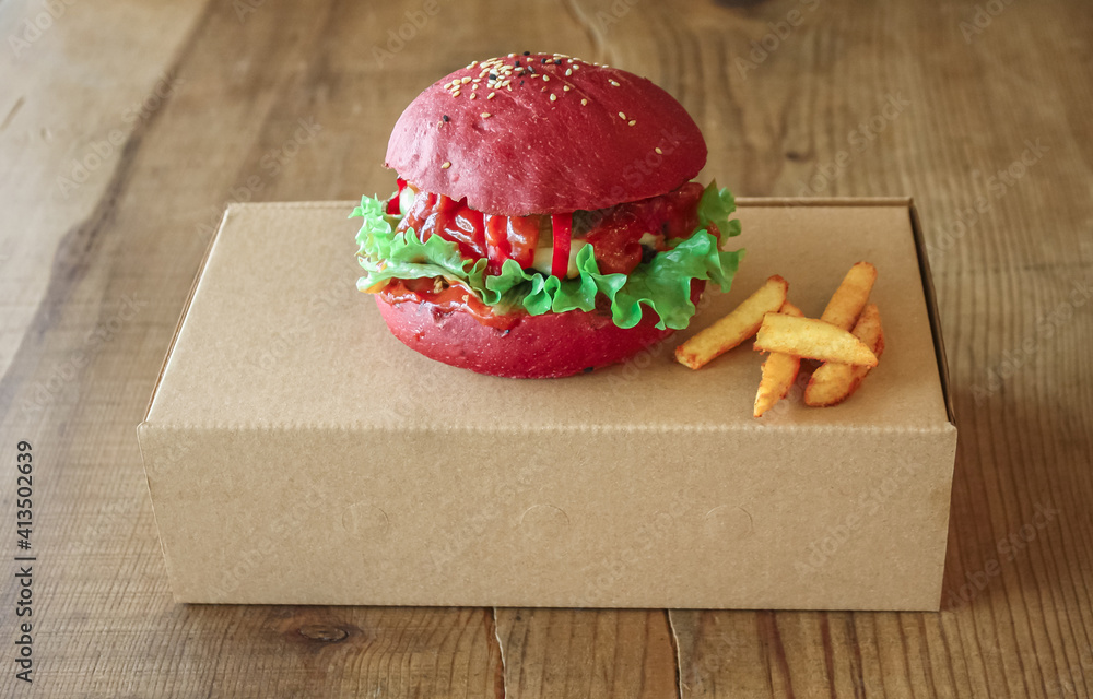 Red hot chilly burger. Mexican burger ready for take away. Stock Photo ...