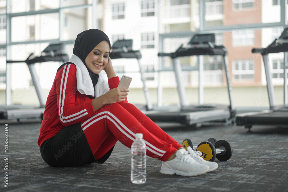 Portrait of attractive young Muslim woman workout in gym healthy ...