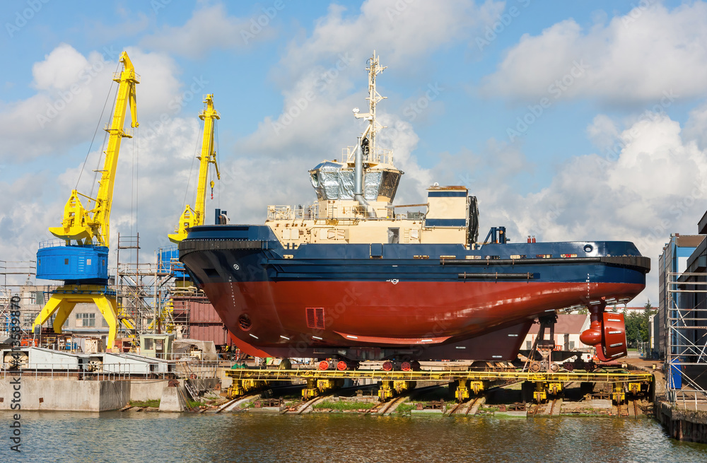 Newly built tugboat at the shipyard. Ready to launch to the water ...