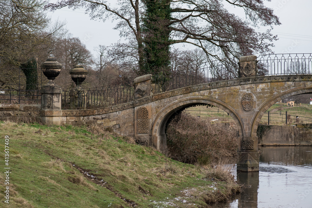 Historical bridge above the river. Dam Head Bridge at Bretton Hall ...