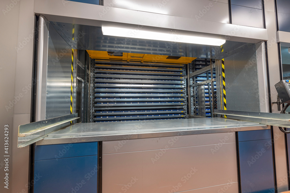 Automated storage system in the warehouse. Vertical carousel storage ...