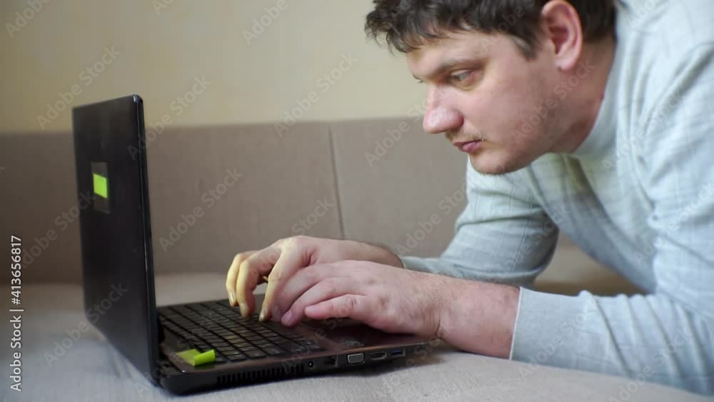 Vidéo Stock work from home.a concentrated middle-aged man working at a ...