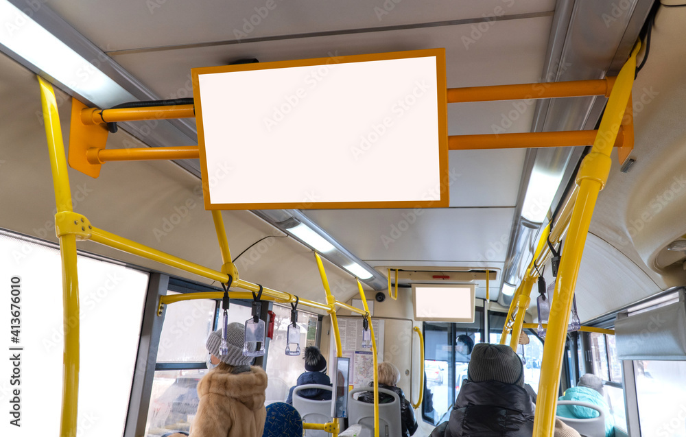 information board in the bus cabin. selective focus. advertising in ...