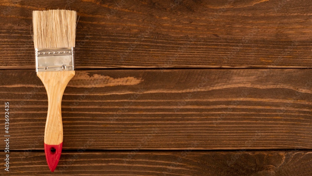 Construction brushes on a wood background. Texture from the ...