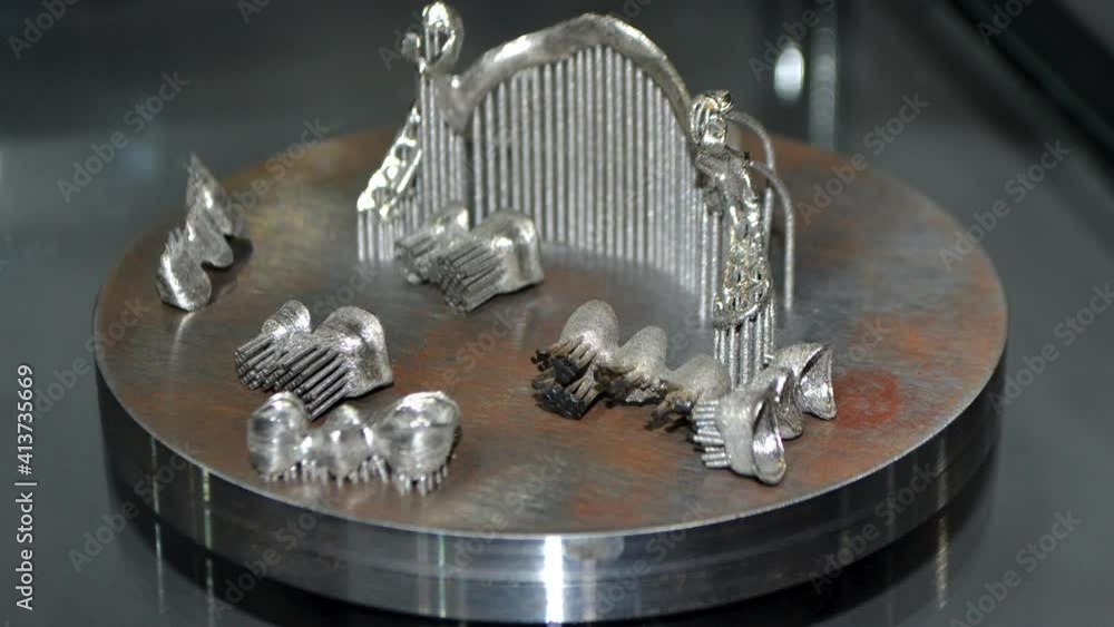 3D model of human teeth printed on metal 3d printer close-up ...