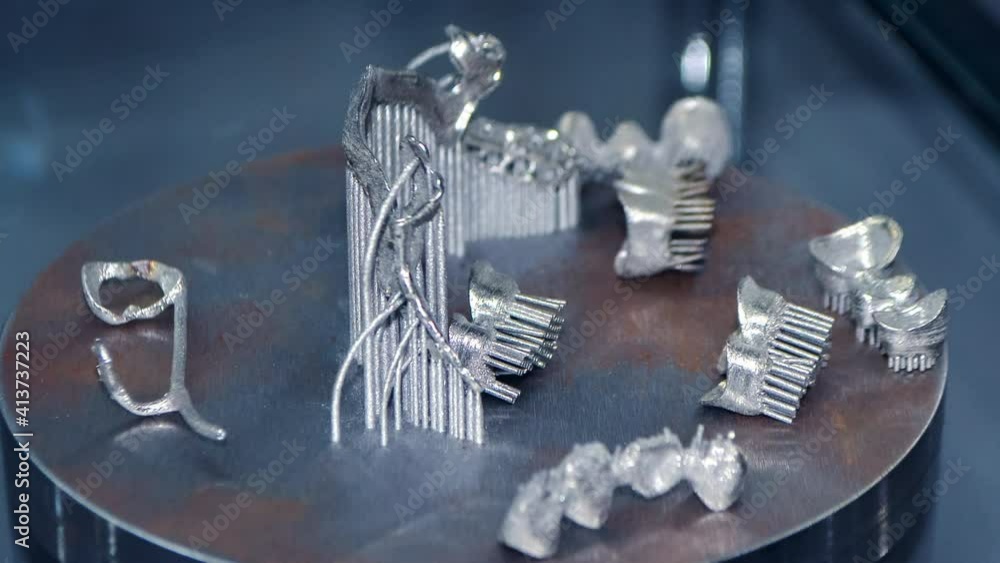 3D model of human teeth printed on metal 3d printer close-up ...