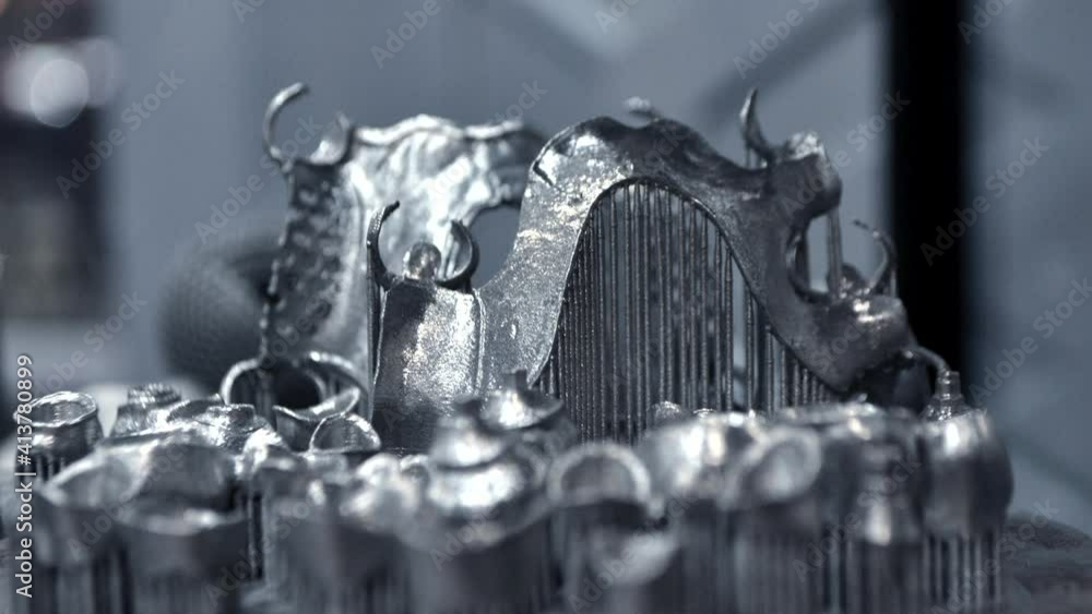 3D model of human teeth printed on metal 3d printer close-up ...