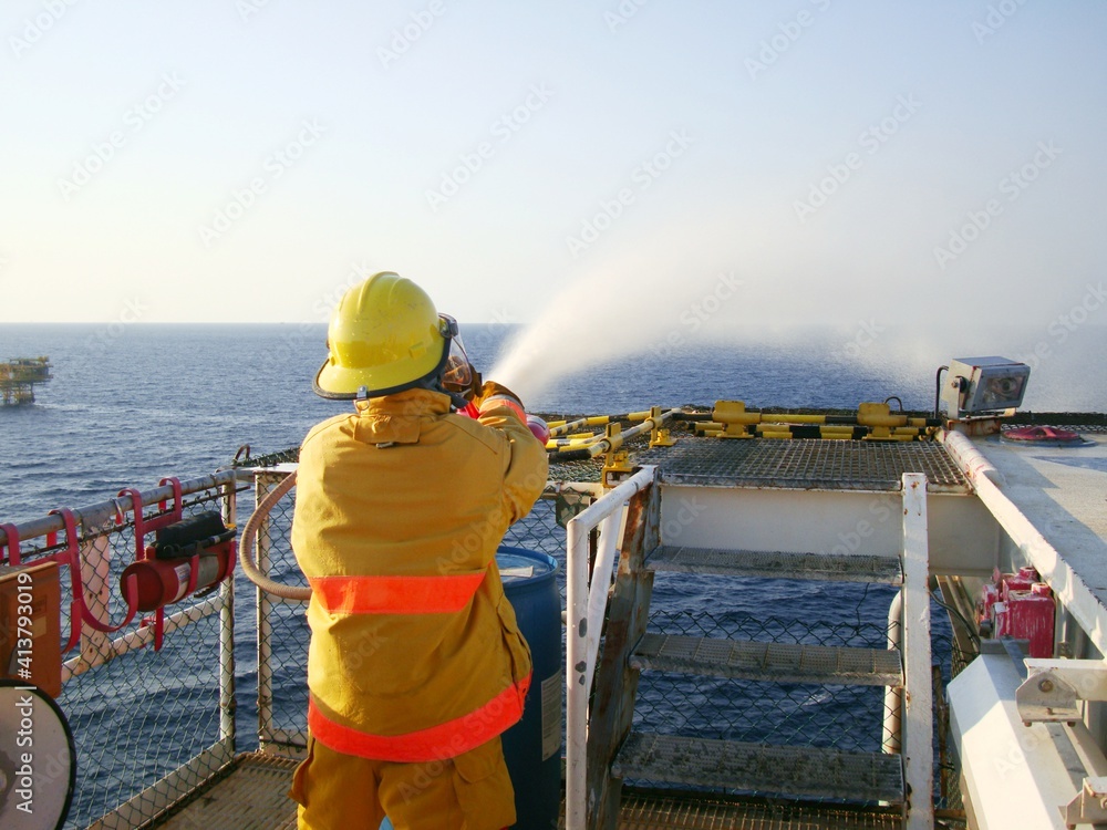 Fire drill training on board for the crew in ship on offshore plant ...