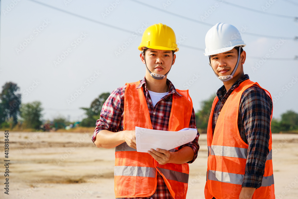 Portrait of Two Engineer, field engineer, foreman, owner standing in ...