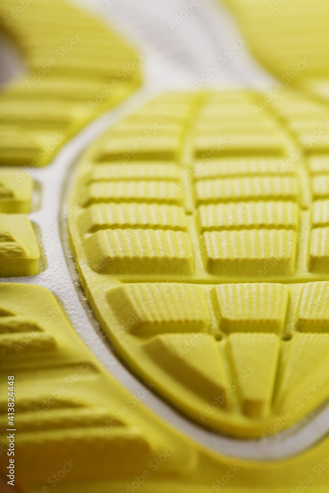 Textured design of the sole of the Tread of a sneaker in yellow Macro ...