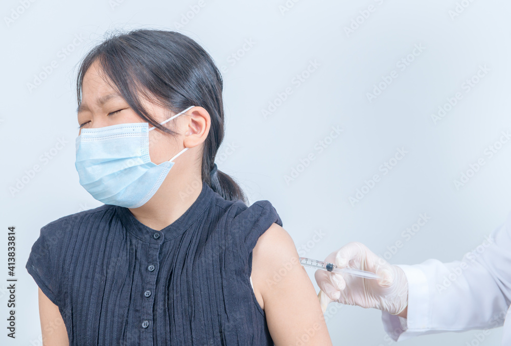 Doctor injecting vaccination in arm of asian little girl,healthy ...
