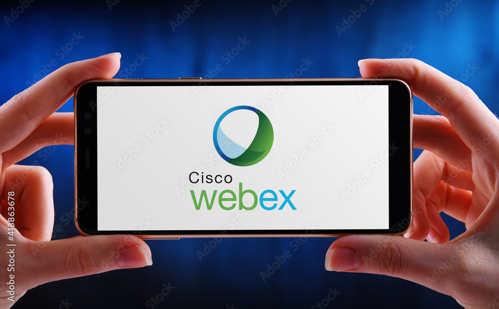 Hands holding smartphone displaying logo of Cisco Webex Stock Photo ...