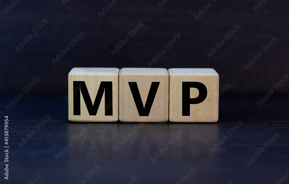 Foto Stock MVP, minimum viable product symbol. Wooden cubes with the ...