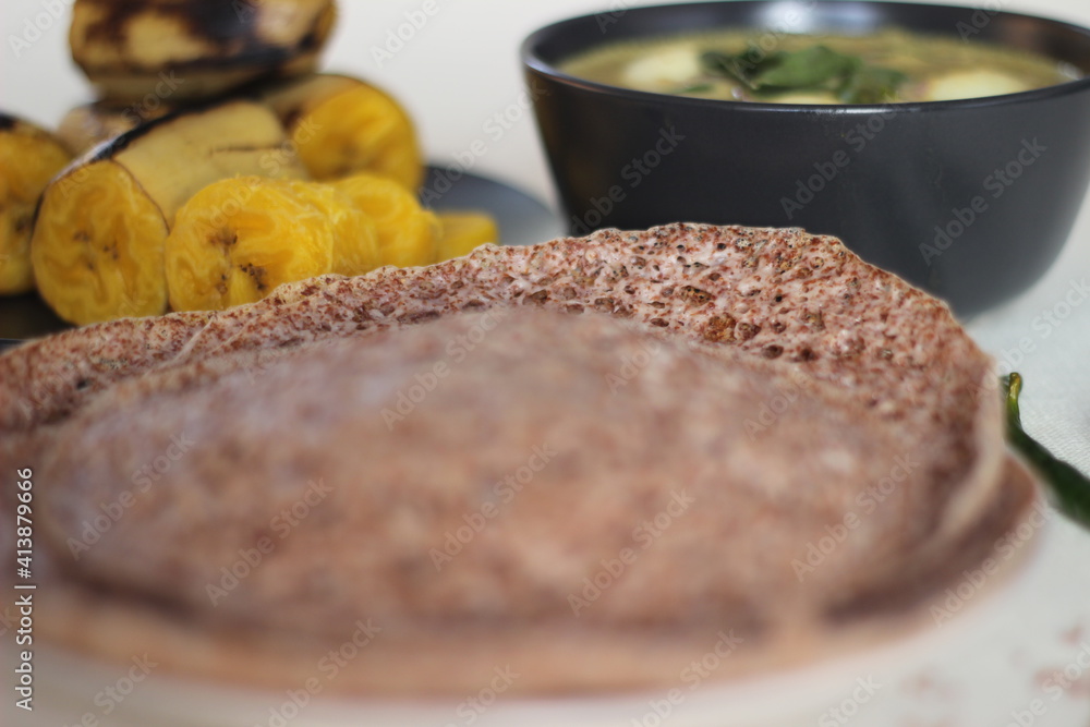 Hoppers made of finger millet served with egg stew prepared in Kerala ...