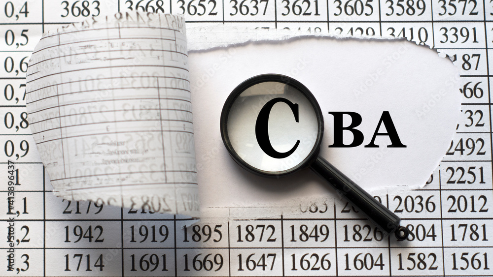 CBA - acronym behind torn paper with numbers on a white background with ...