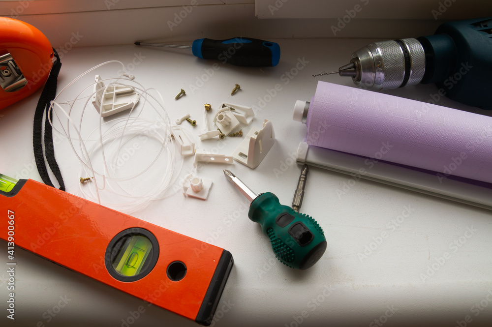 Installation of a window roller with a holder. Installation tool. Stock ...