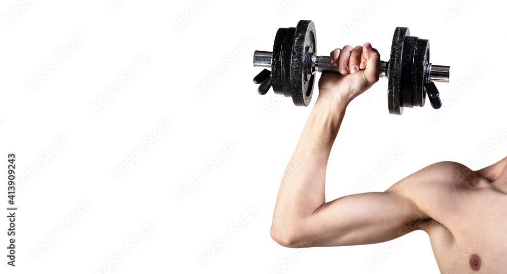 Skinny guy hold dumbbells up in hands. A thin man in sports with ...