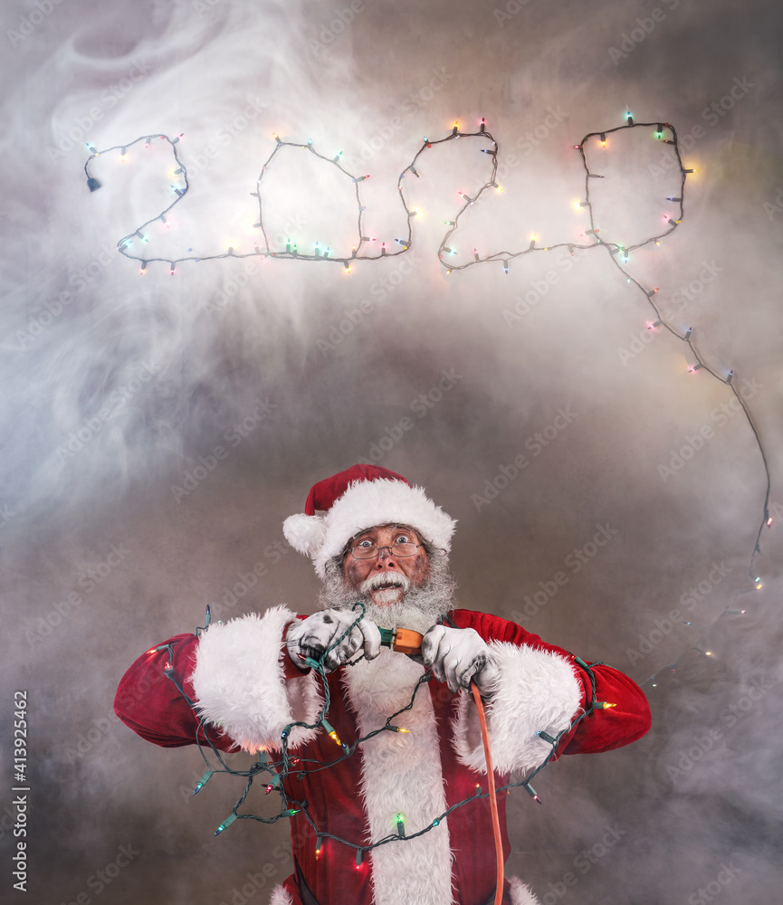 Santa Claus saying goodbye to the year 2020 getting shocked by electric ...